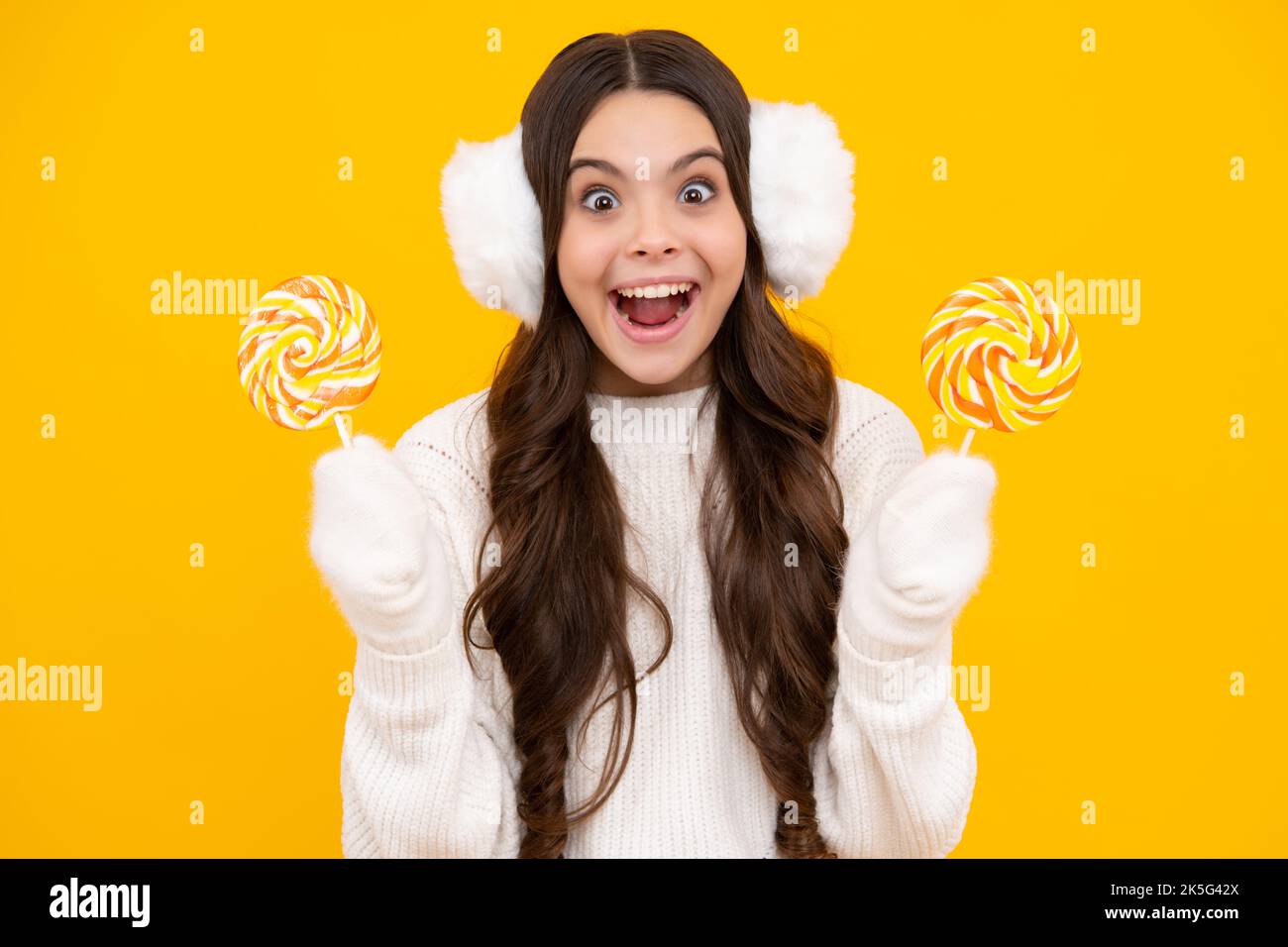 Excited teenager girl with caramel candies on sticks, sweet sugar ...