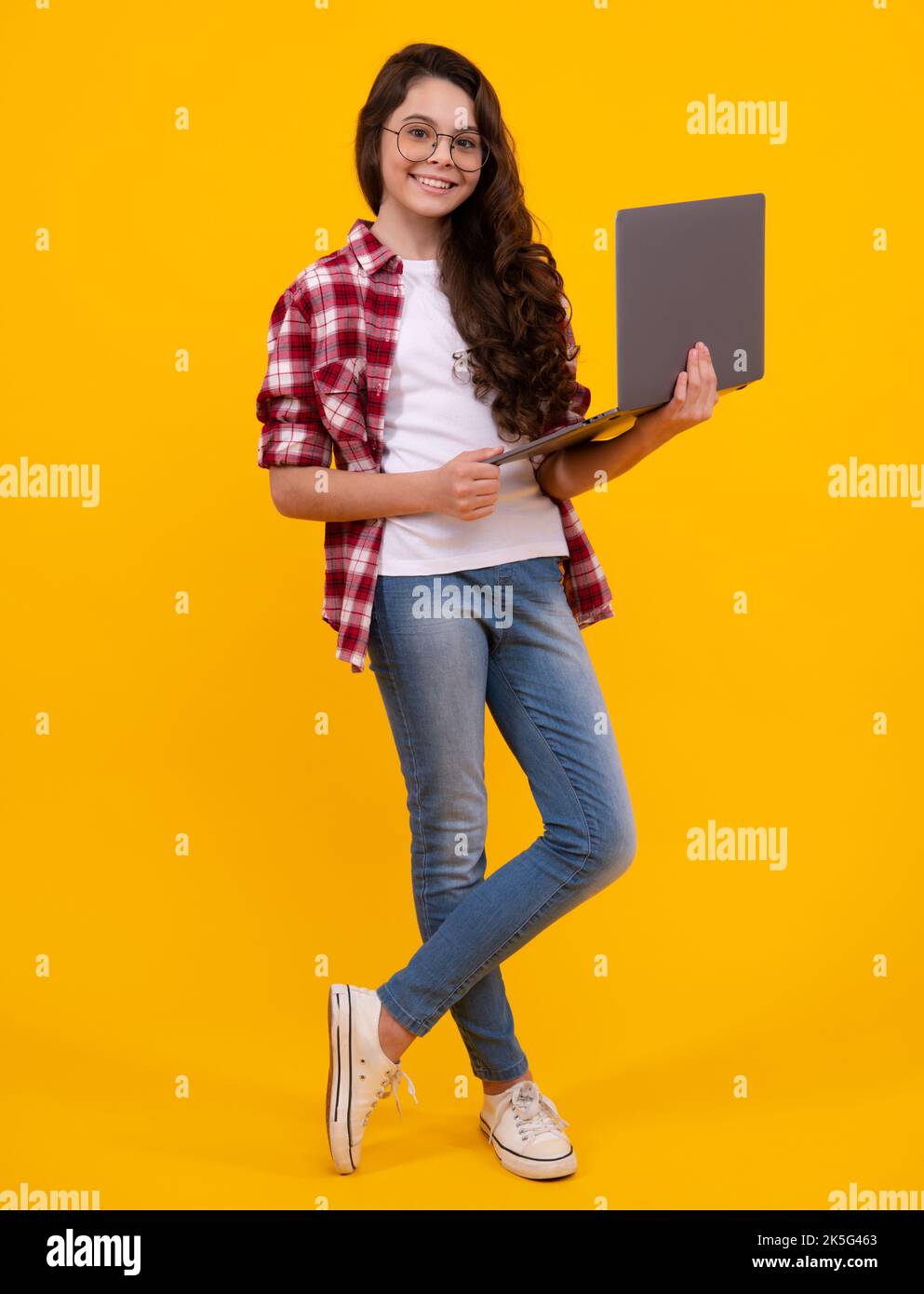 Young student school girl, studying with laptop computer. E-learning ...