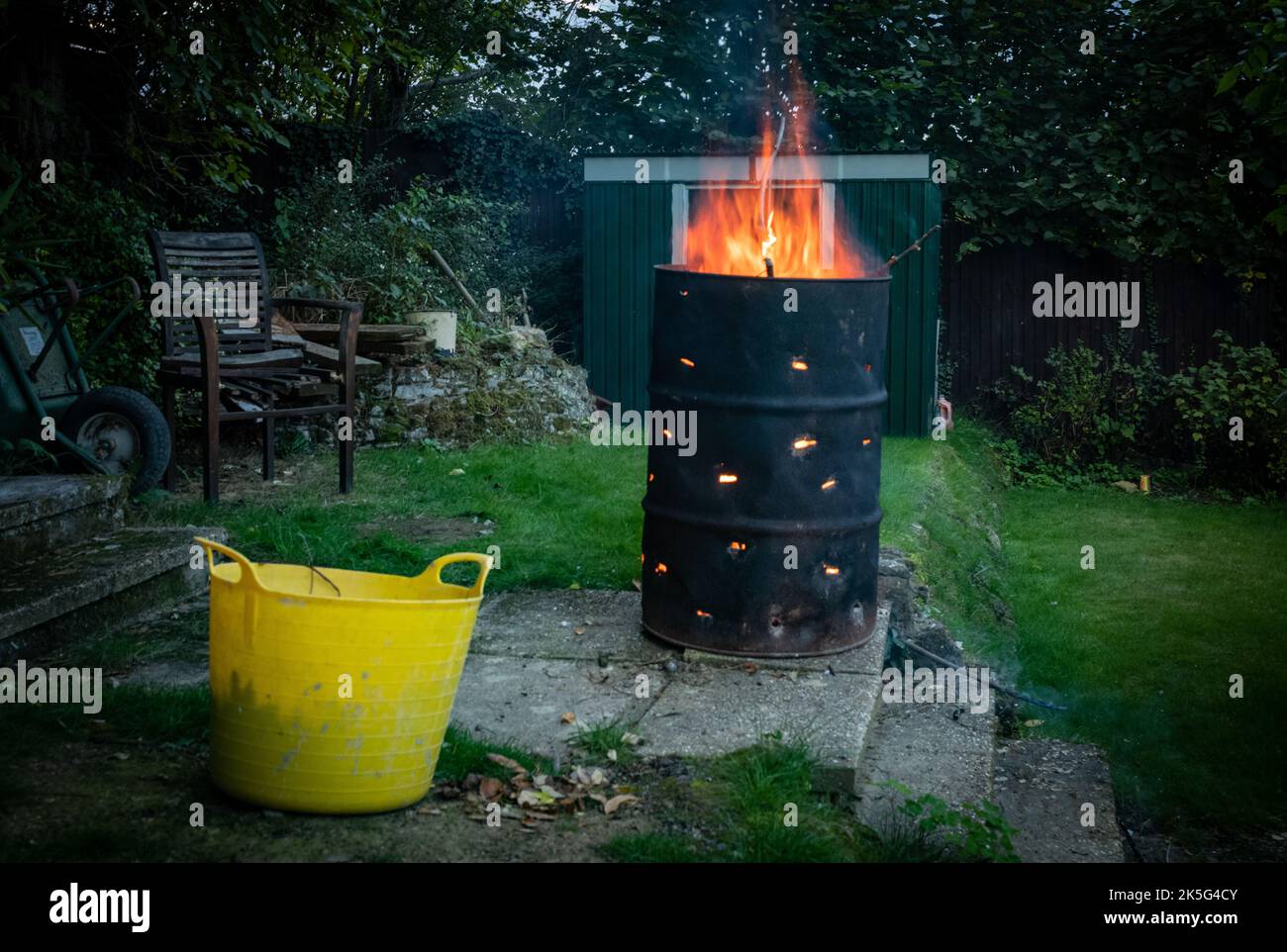 A blazing bonfire in an adapted oil drum in a garden in Billingshurst ...