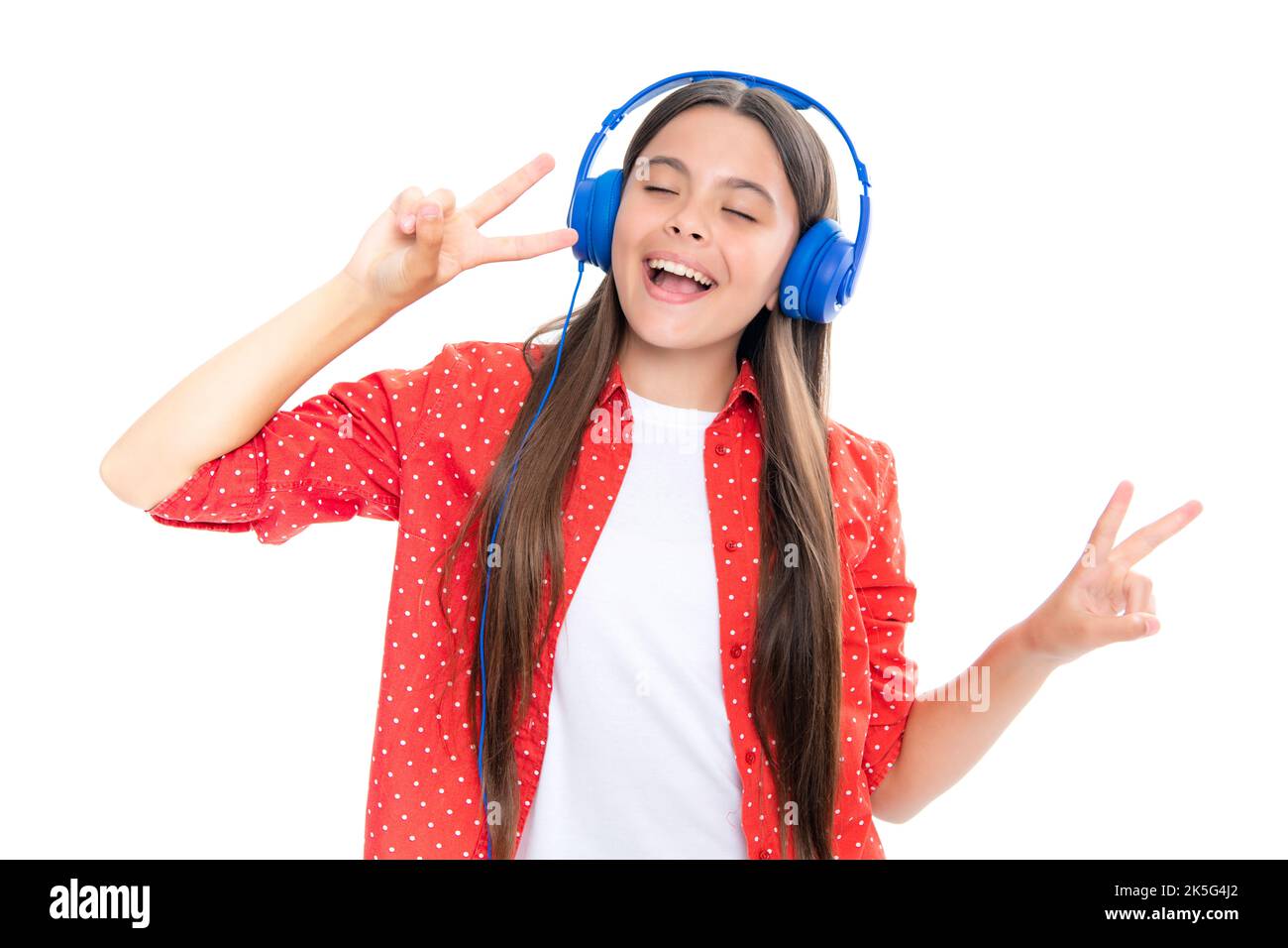 Funny kid girl 12, 13, 14 years old listen music with headphones ...