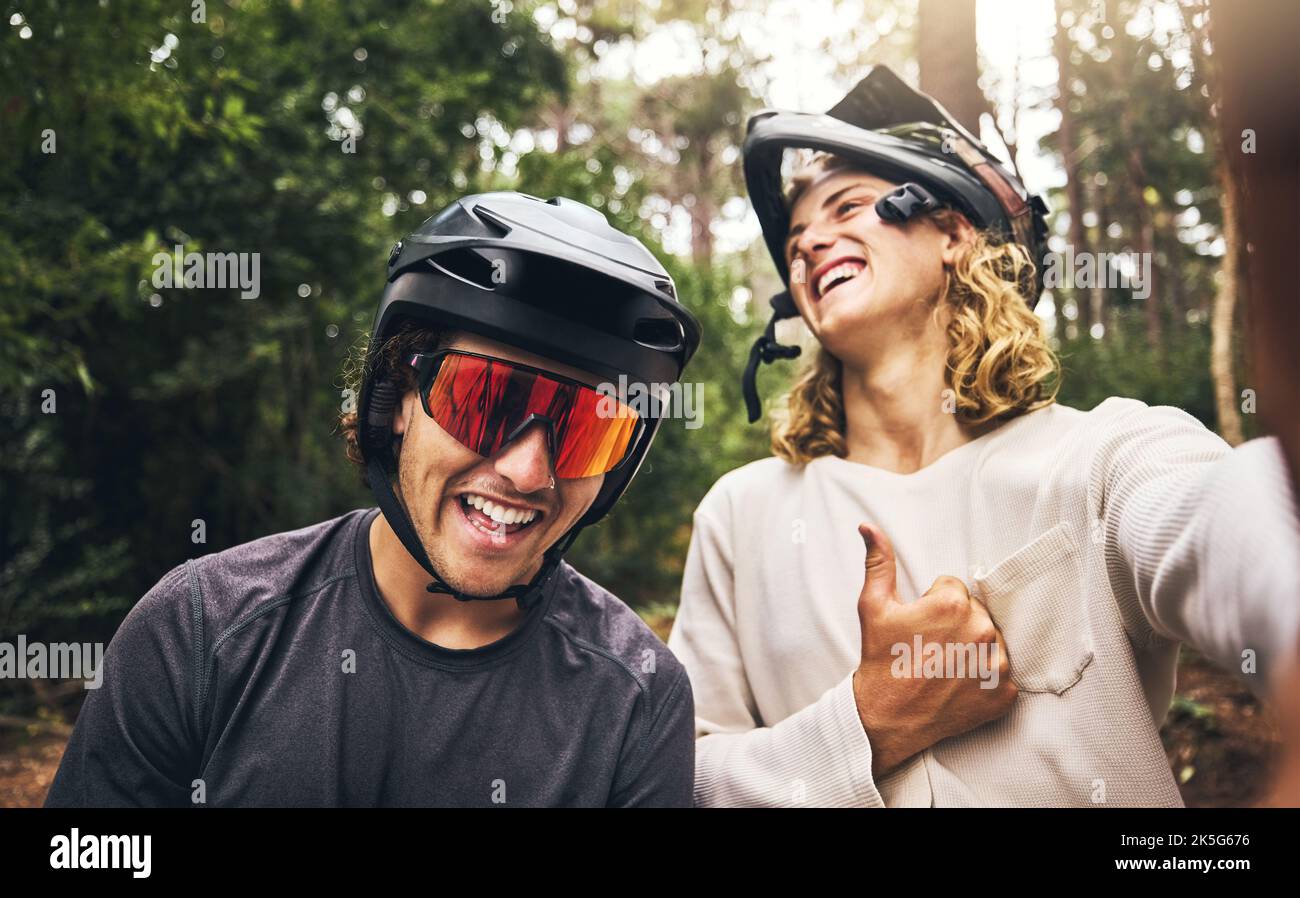 Friends, cycling men and selfie in forest, park or woods cyclist trail ...