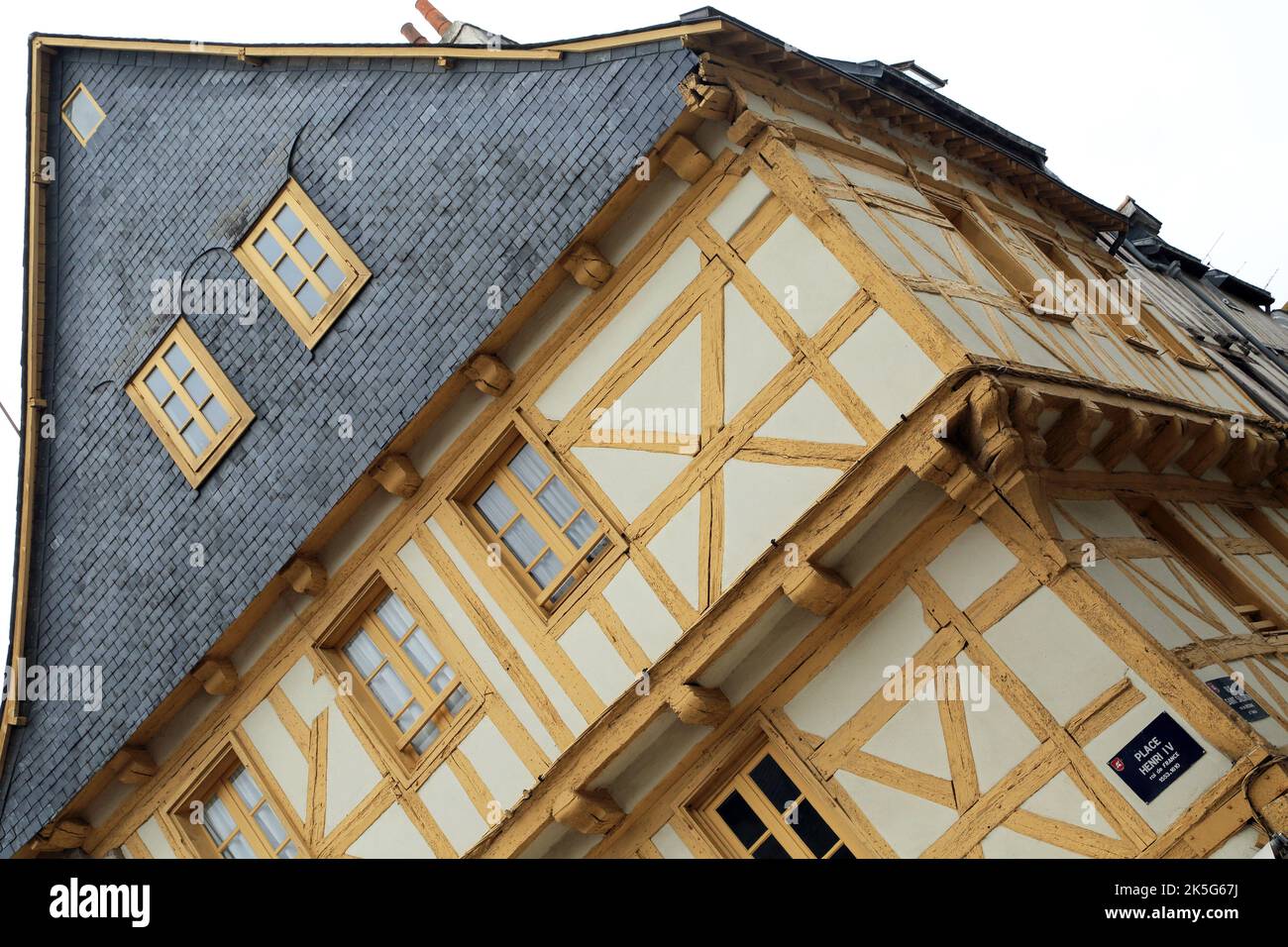 Orange and cream half timbered medieval building with slate roof in ...