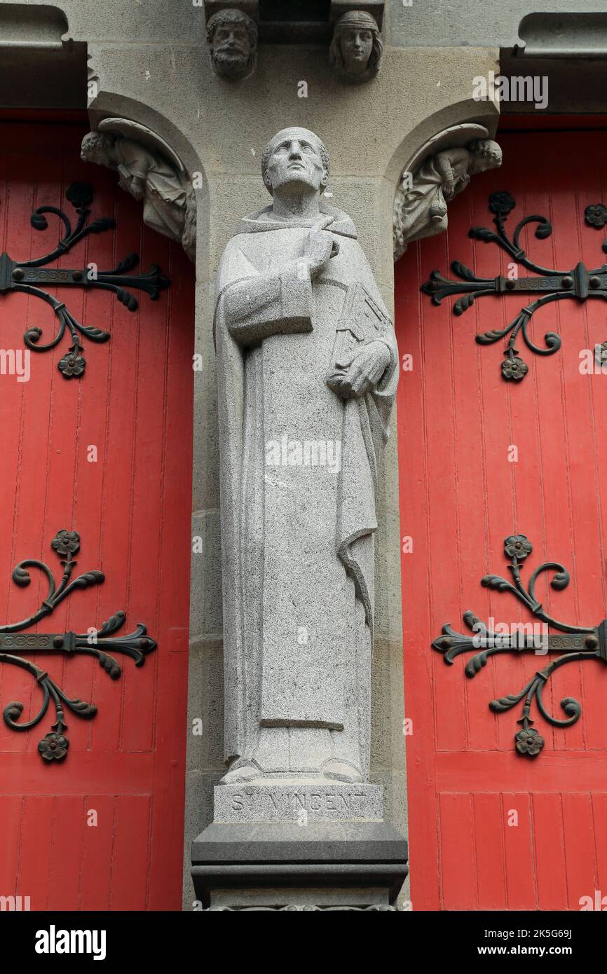 Statue of Saint Vincent Ferrier between the two entrance doors to ...