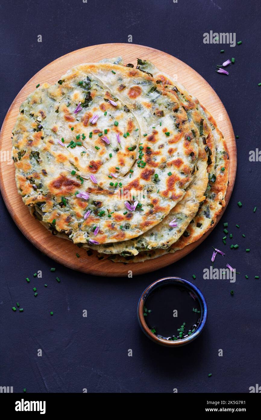 Homemade appetizing scallion pancakes served with soy sauce Stock Photo ...