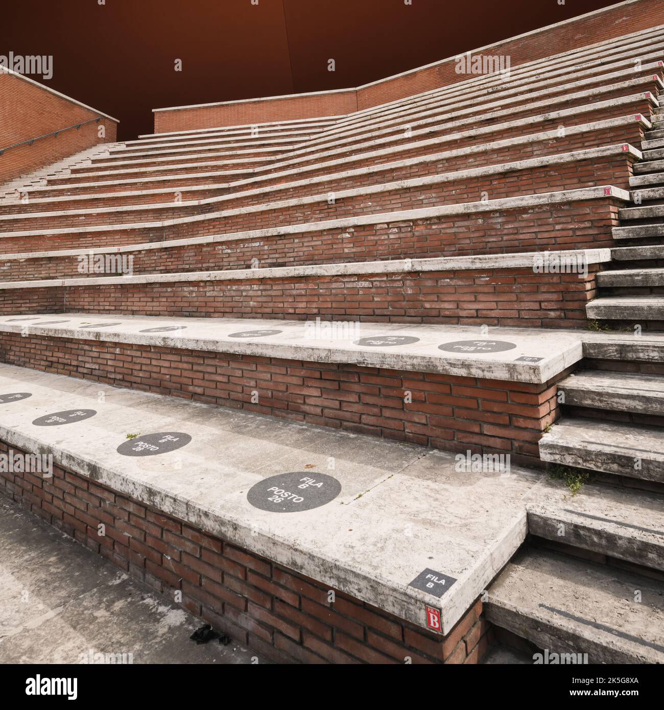A stairs and numbered sitting area in a room of concert hall in the ...