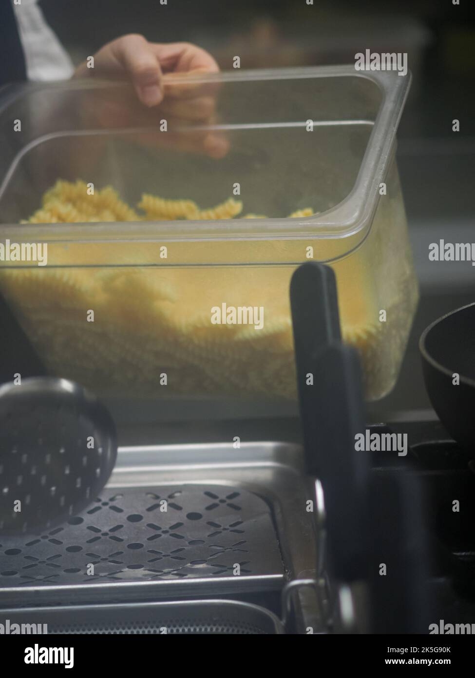 Pasta boiler in professional kitchen of restaurant Stock Photo - Alamy