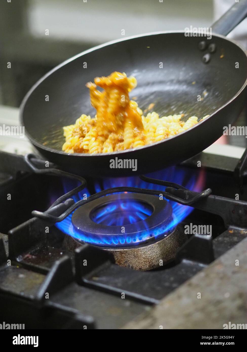 Chef tossing flame hi-res stock photography and images - Alamy