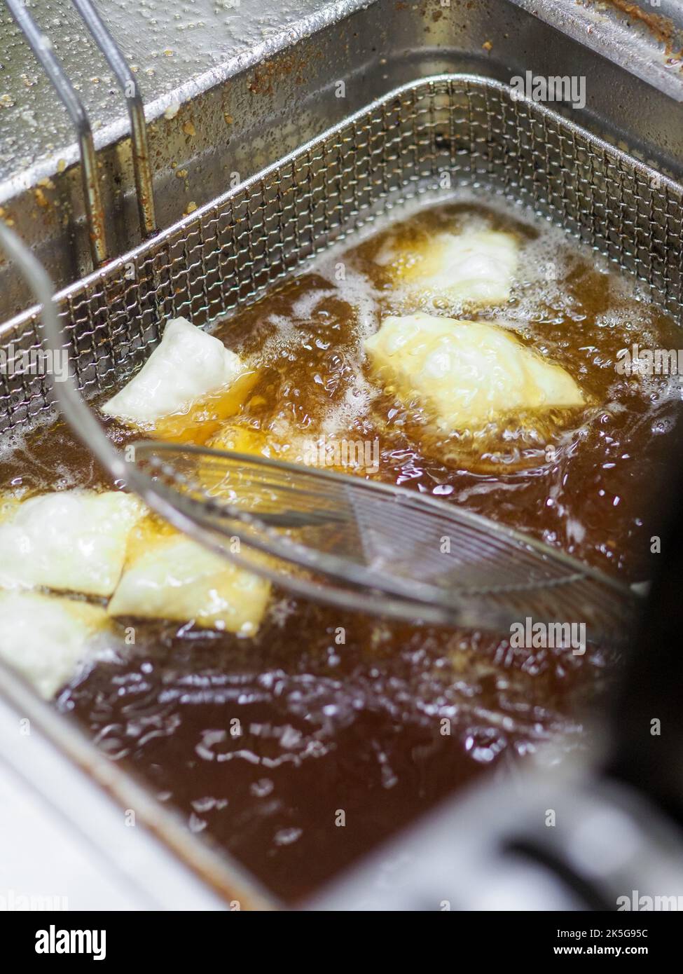 frying french fries in kitchen Stock Photo - Alamy