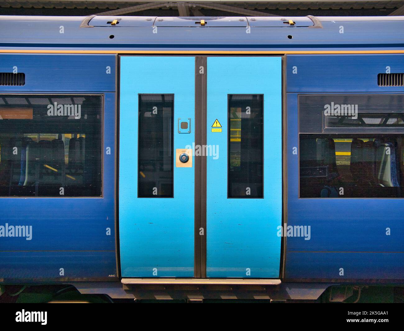 The light blue, closed, doors of a southeastern Railways dark blue ...