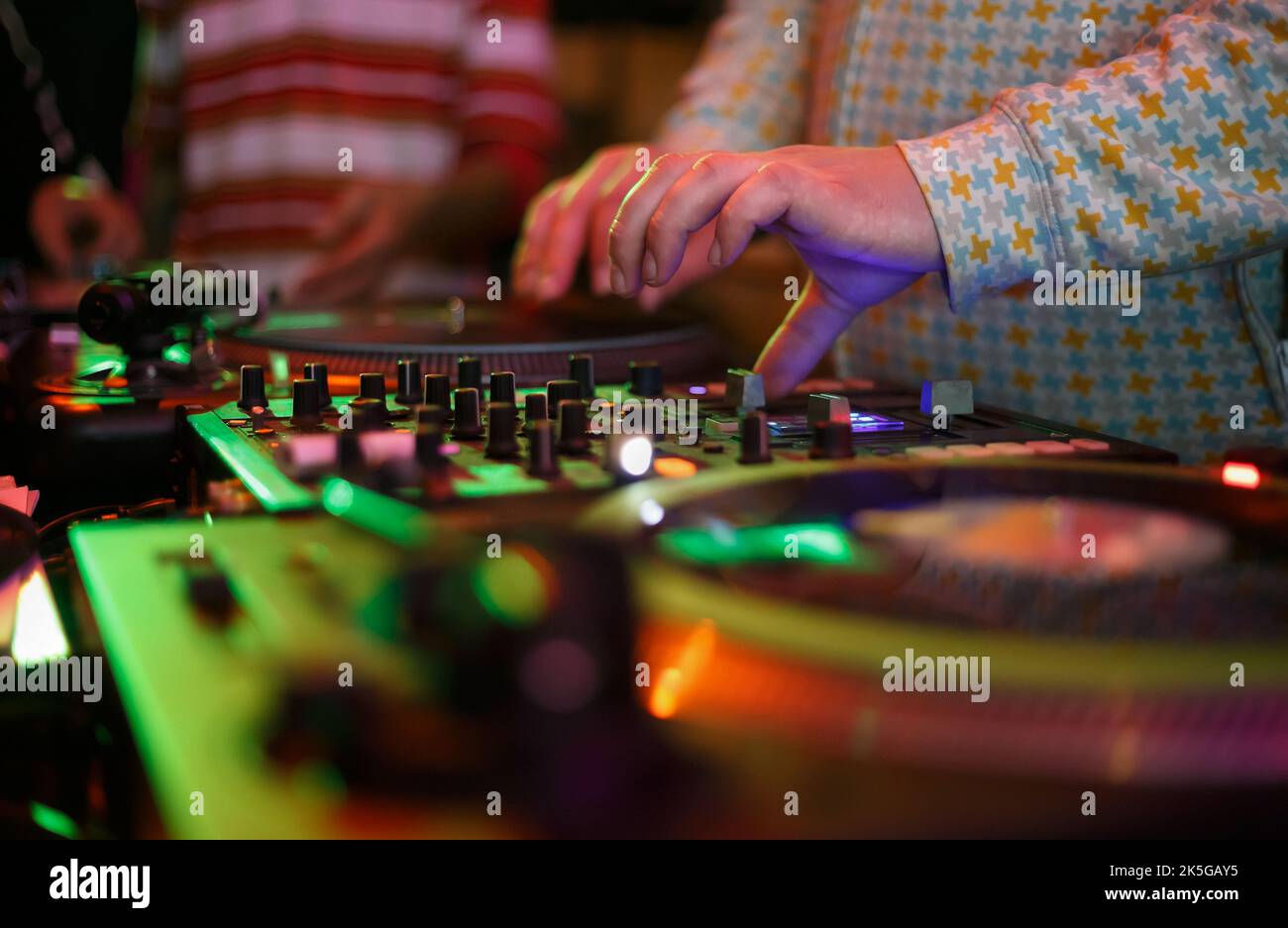 Hip hop dj scratches records and plays music on hip hop party in ...