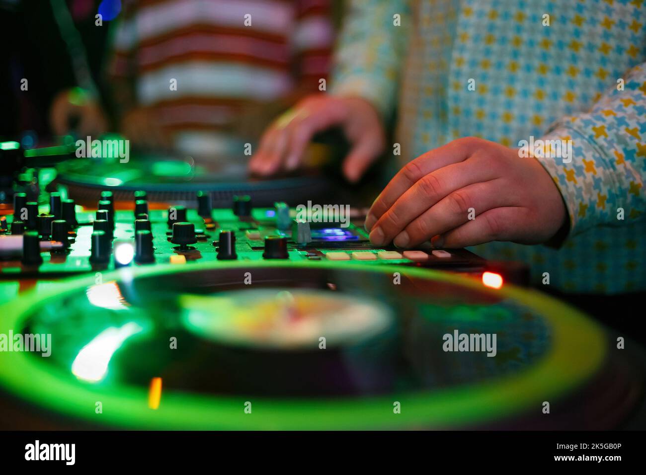 Hip hop dj scratches vinyl record on turn table. Professional disc ...