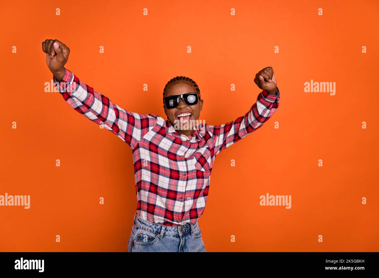 Portrait of cheerful satisfied lady raise fists up enjoy dancing ...