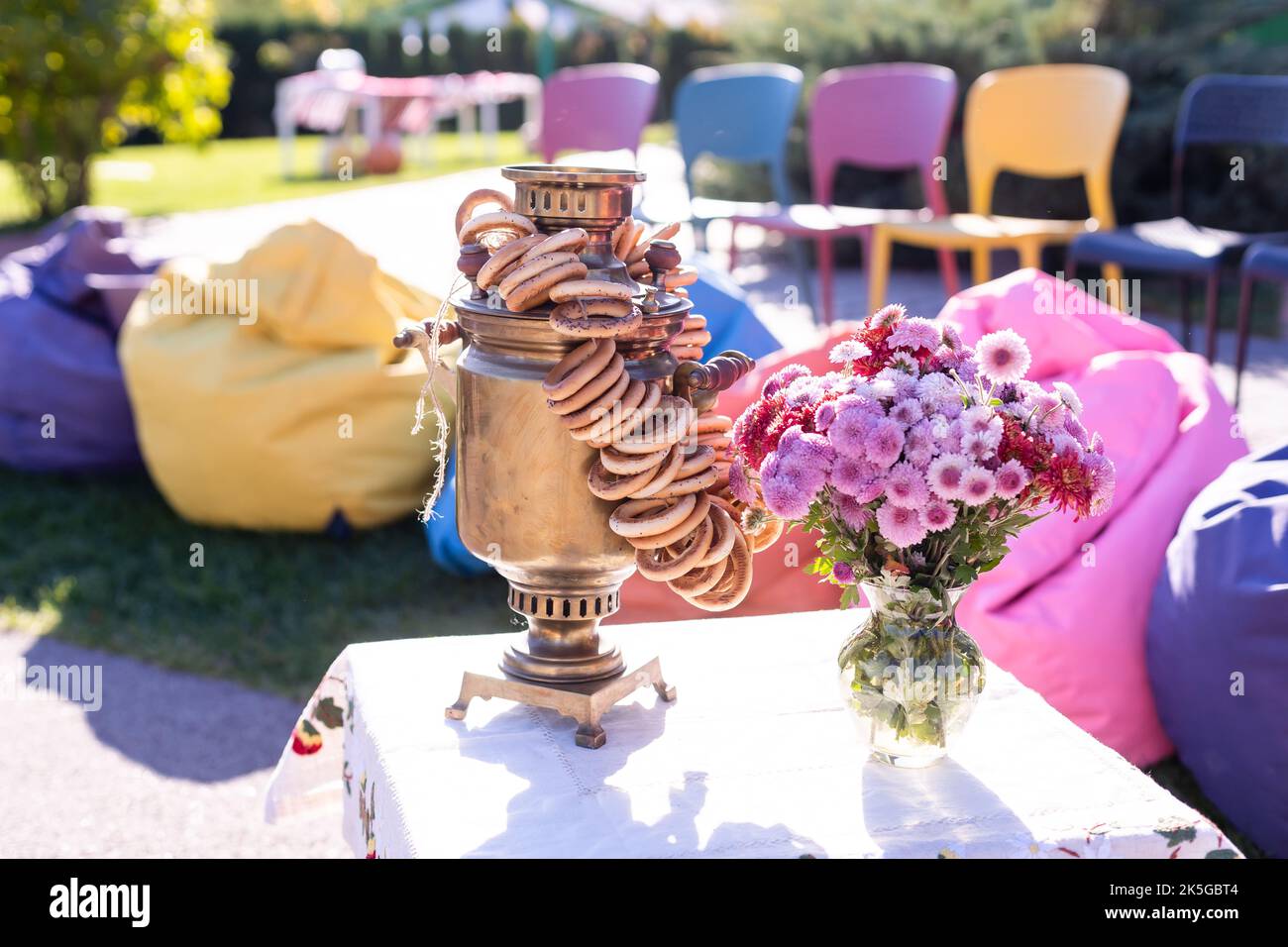 Bagels are hanging on the samovar. Tea from a samovar with bagels. Tea ...