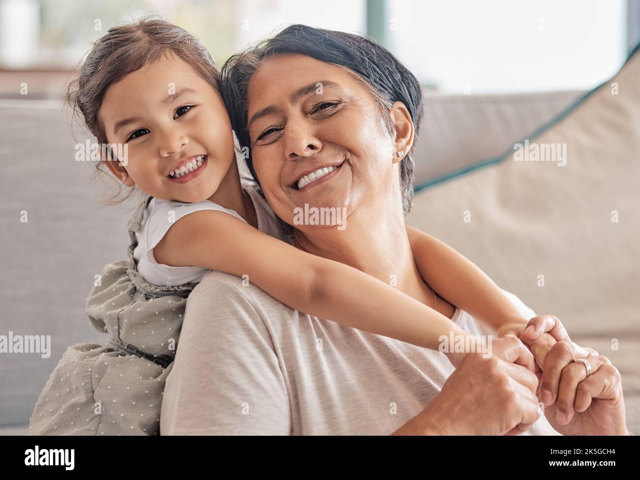 Girl, grandma and sofa smile for love in bonding time together in home ...