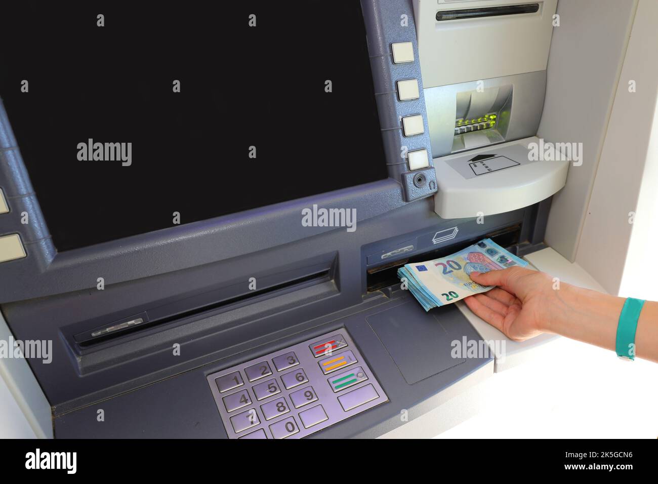 hand taking money from the bank ATM cash machine Stock Photo - Alamy