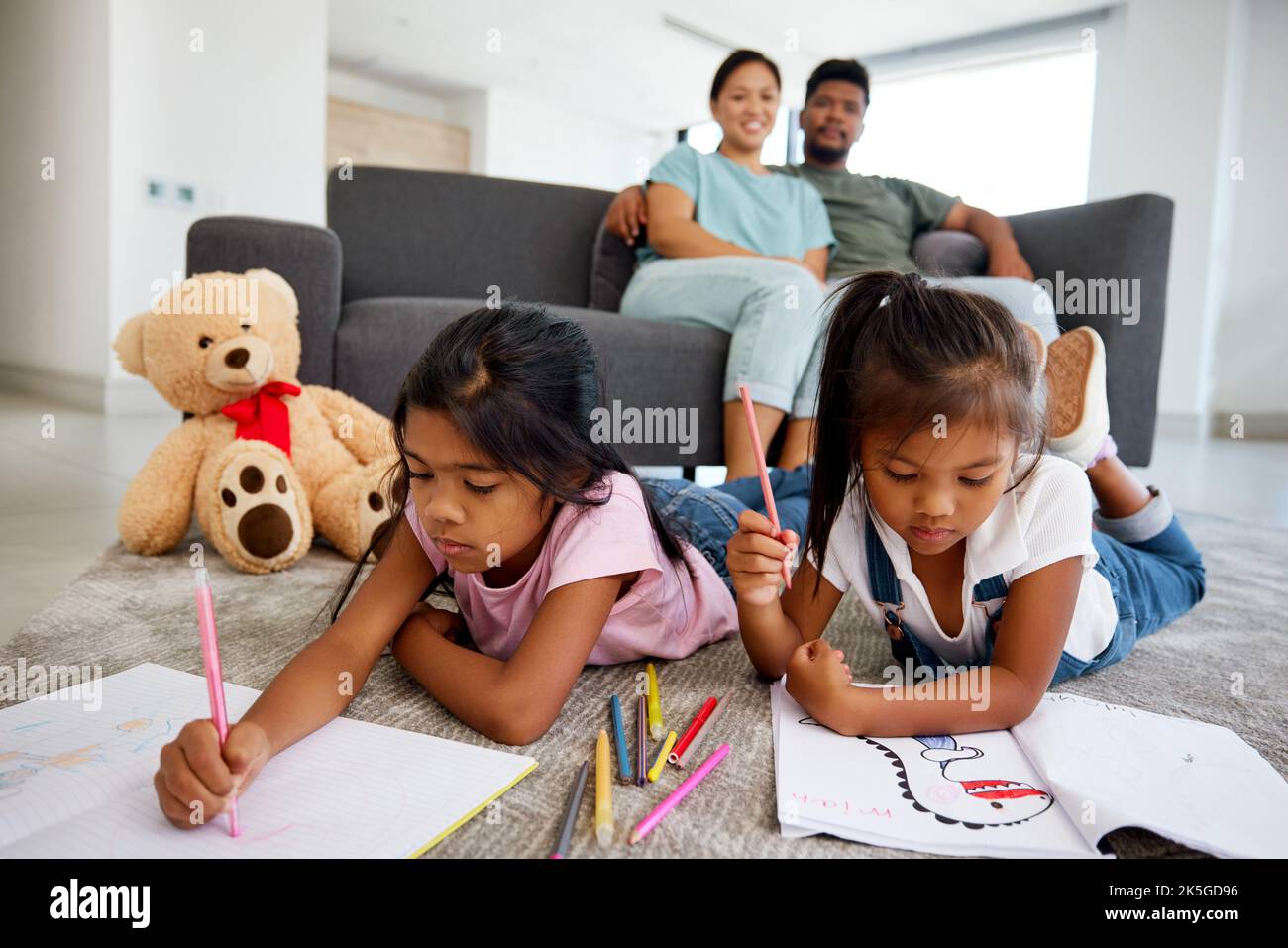Children drawing, notebook education and parents in living room to ...