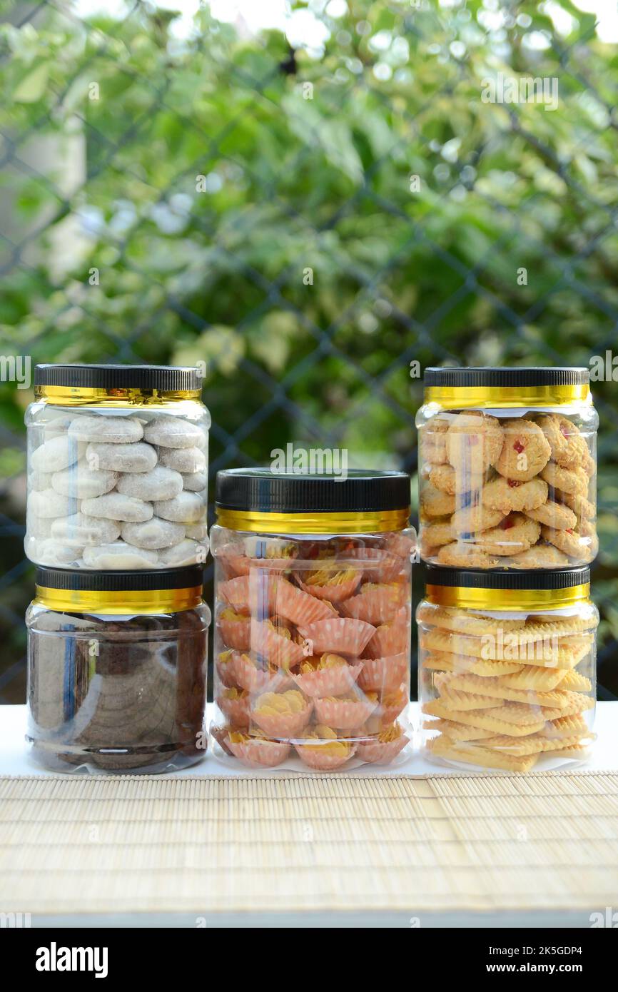 A malaysian famous cookies in a jar with a outdoor background ...