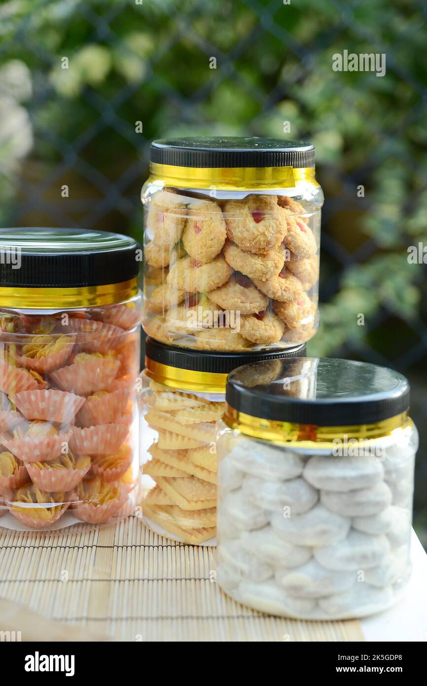 A malaysian famous cookies in a jar with a outdoor background ...