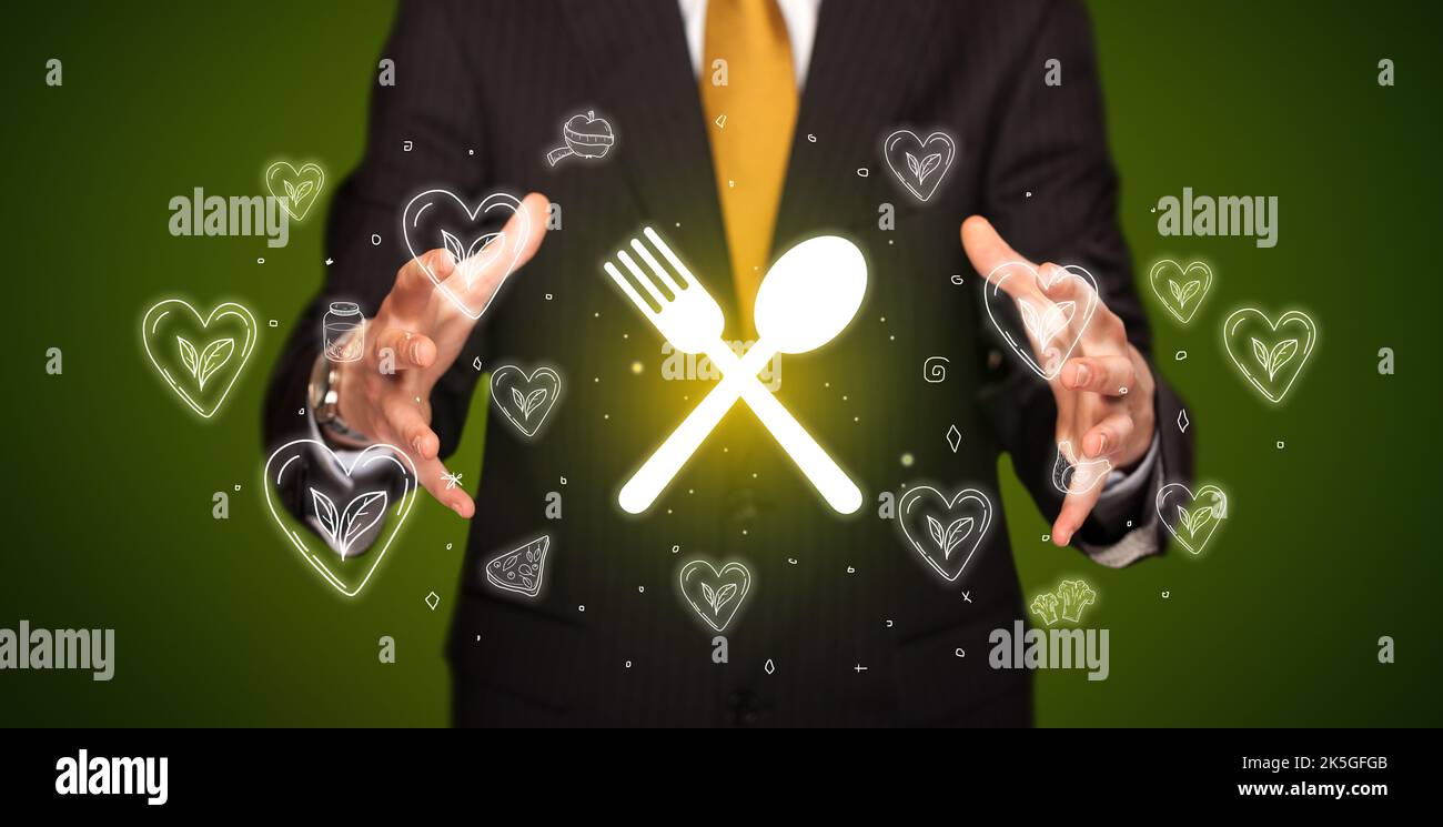 Hand holding food related icons Stock Photo - Alamy