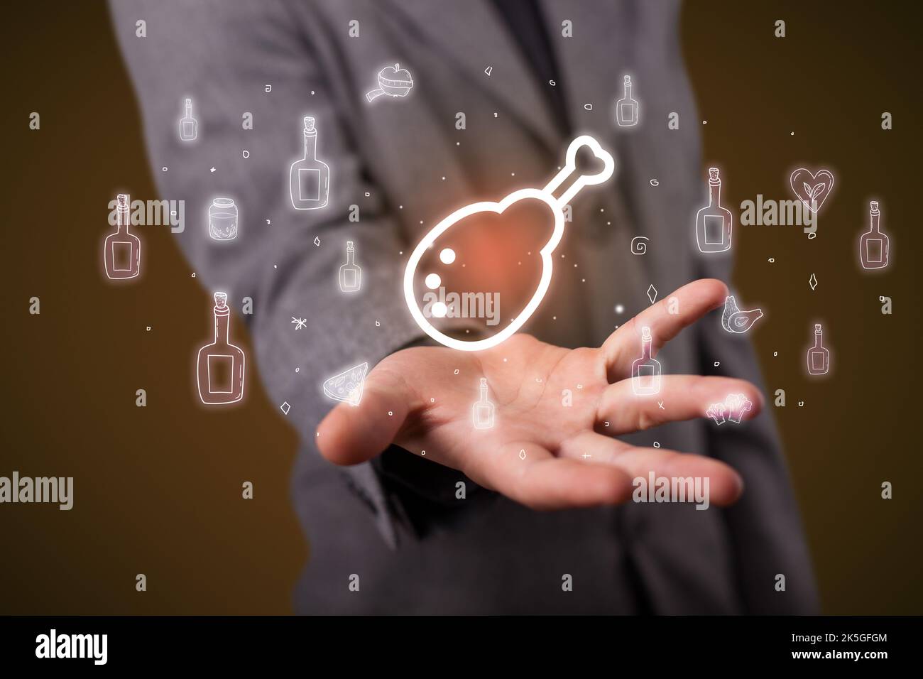 Hand holding food related icons Stock Photo - Alamy