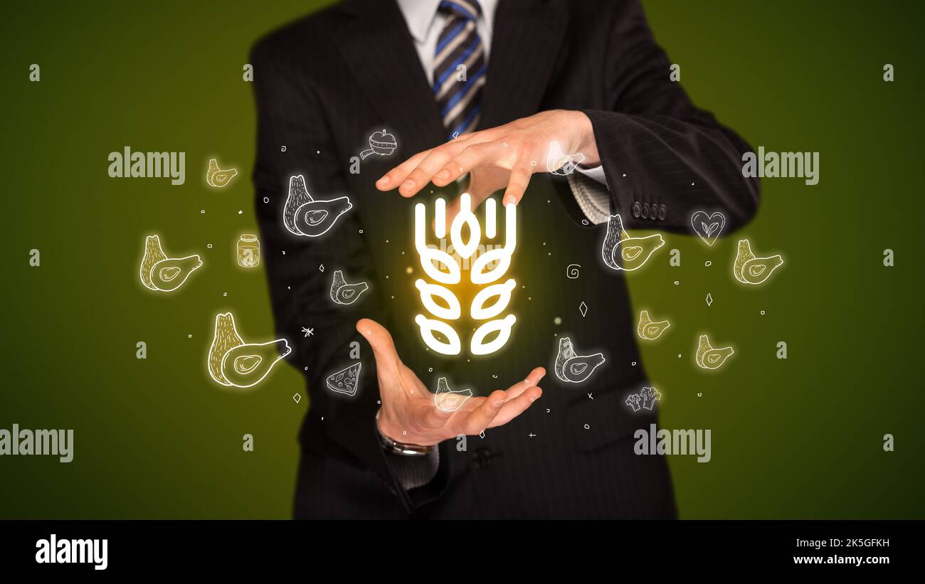 Hand holding food related icons Stock Photo - Alamy
