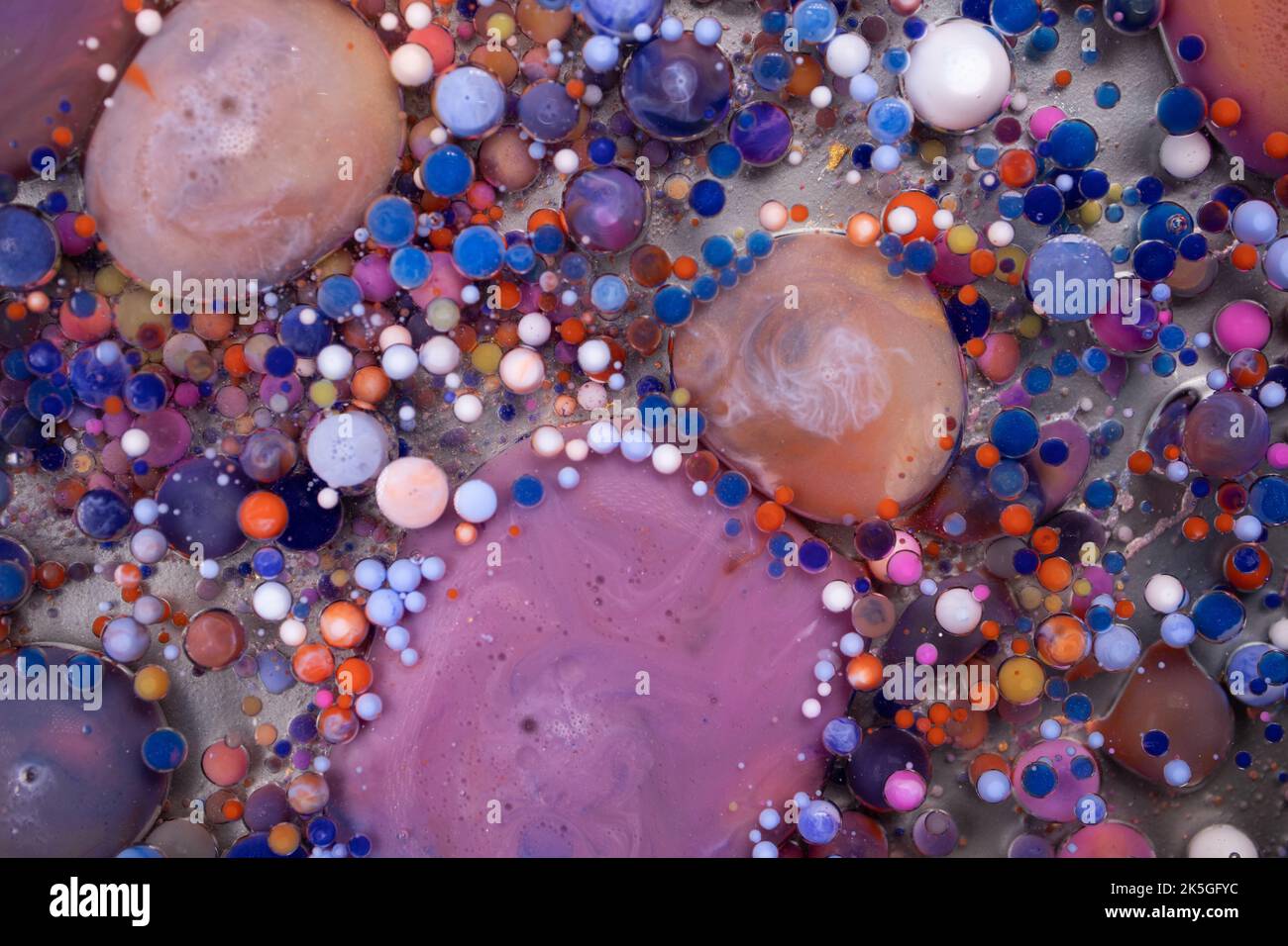 Acrylic paint balls abstract texture. Bright colors fluid, flowing ...