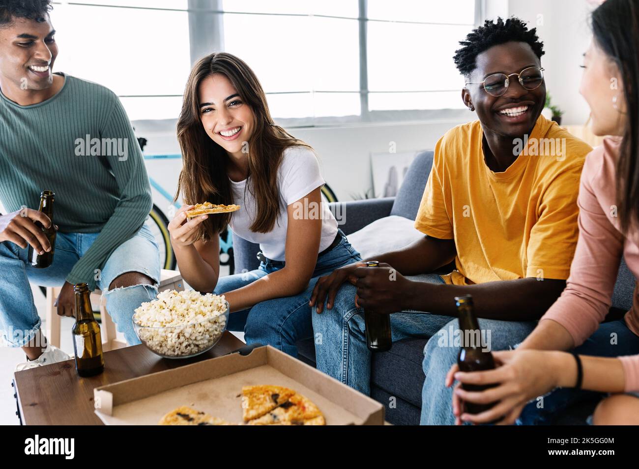 Happy Diverse Friends Having Fun Together Eating Pizza At Home Stock