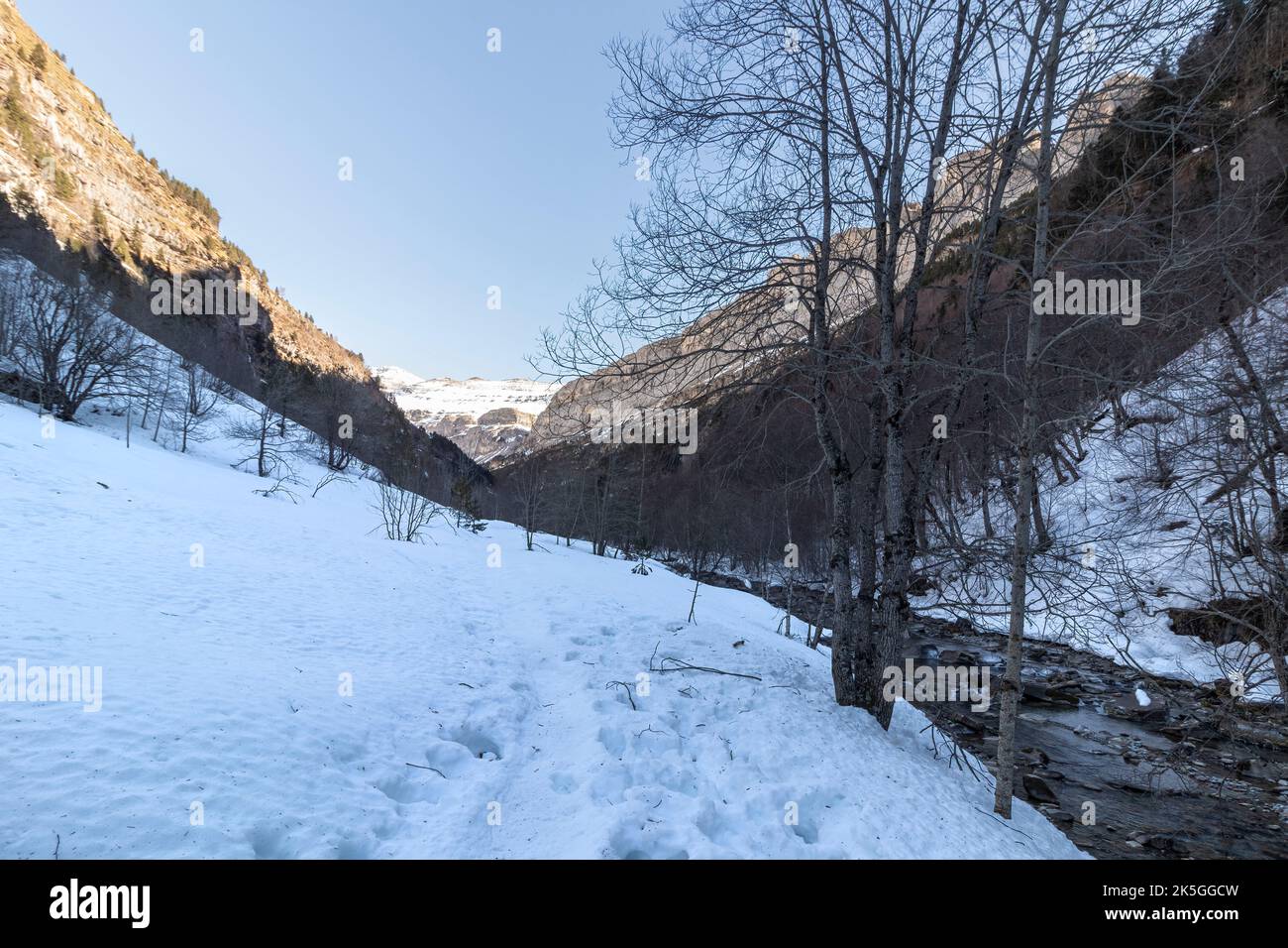 snowy path along the river in ordesa national park in the spanish ...