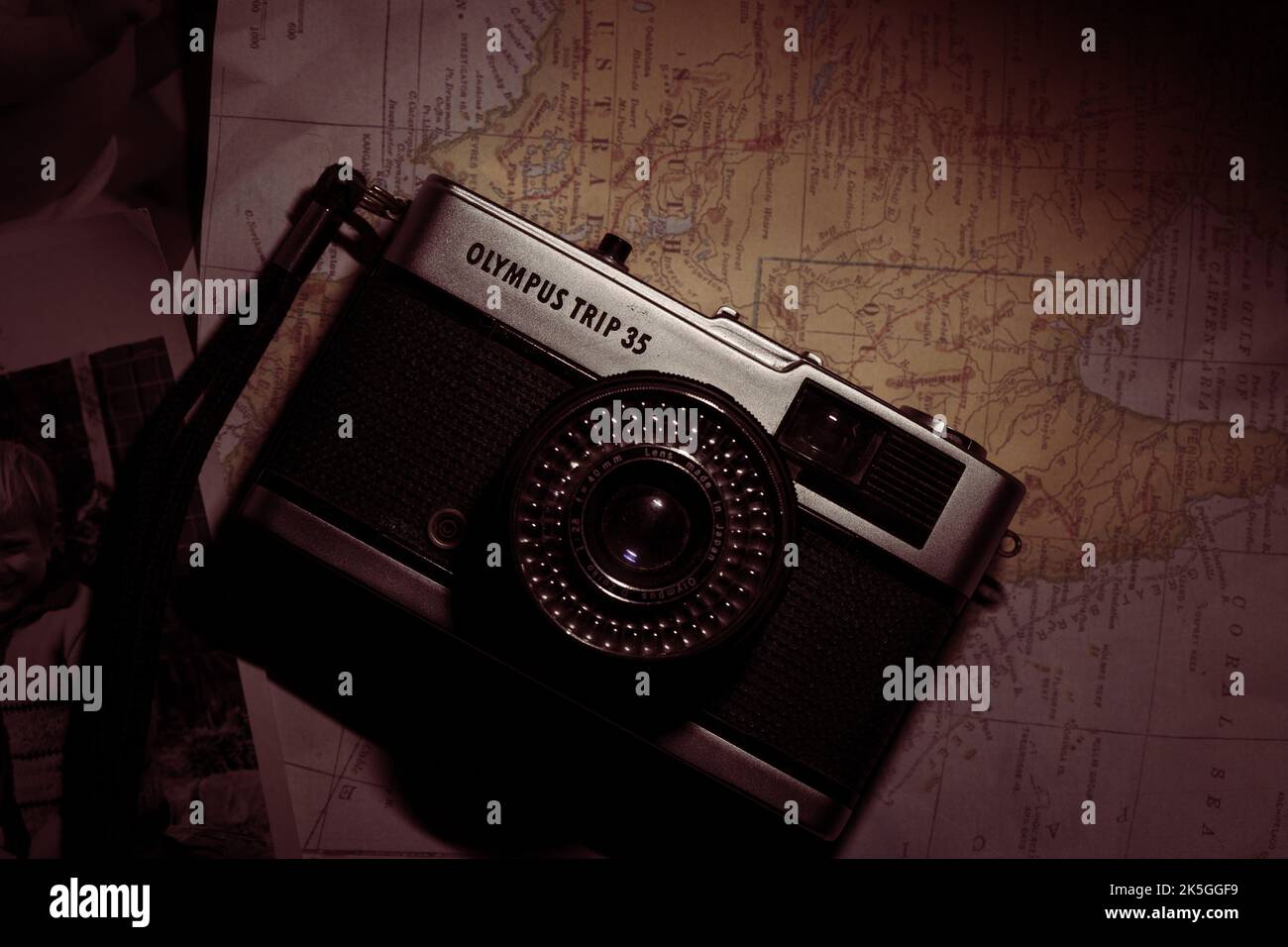 A top view shot of a vintage film camera sitting on a map Stock Photo ...