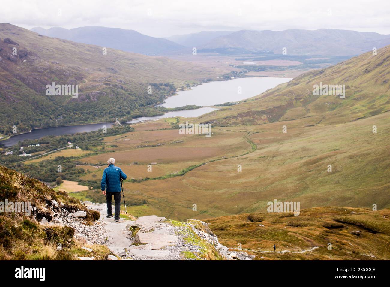 An older male walking the mountains of Connermara in Galway Mayo ...