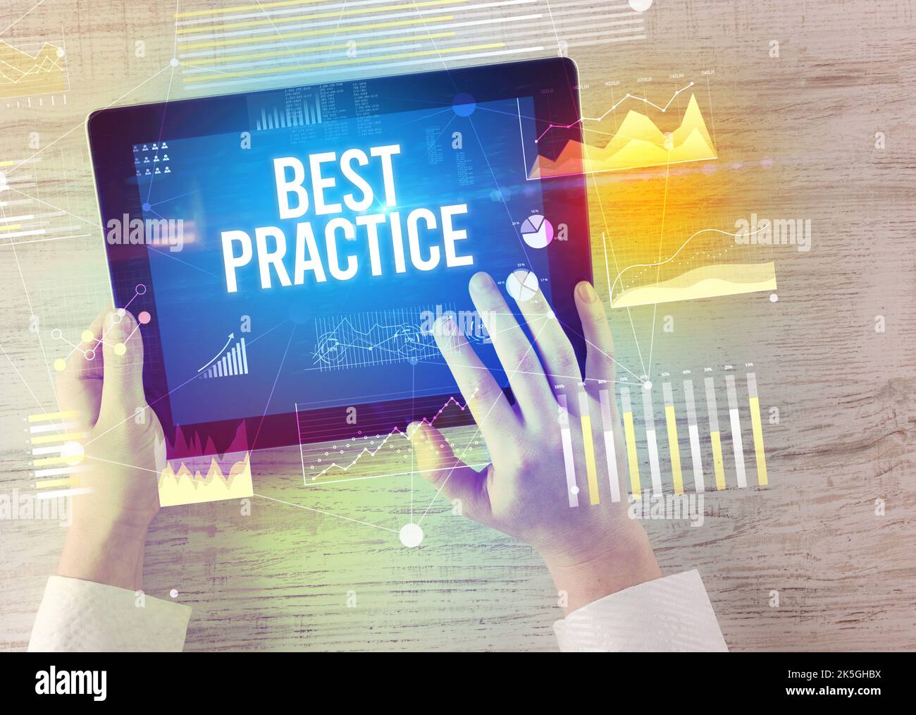 Close-up of hands holding tablet with business inscription Stock Photo ...