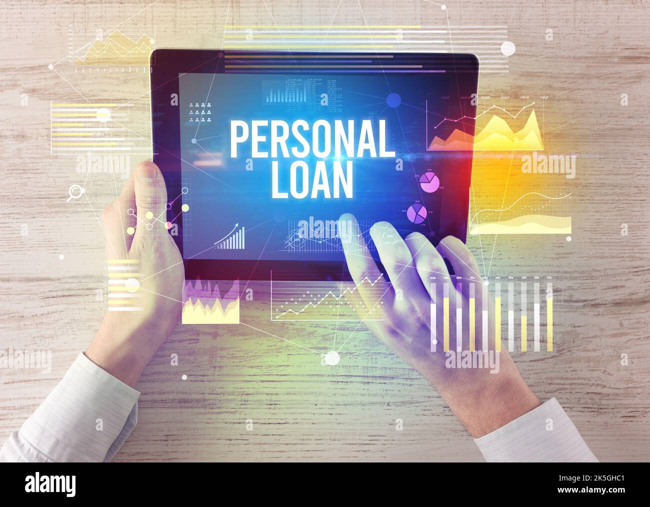 Close-up of hands holding tablet with business inscription Stock Photo ...