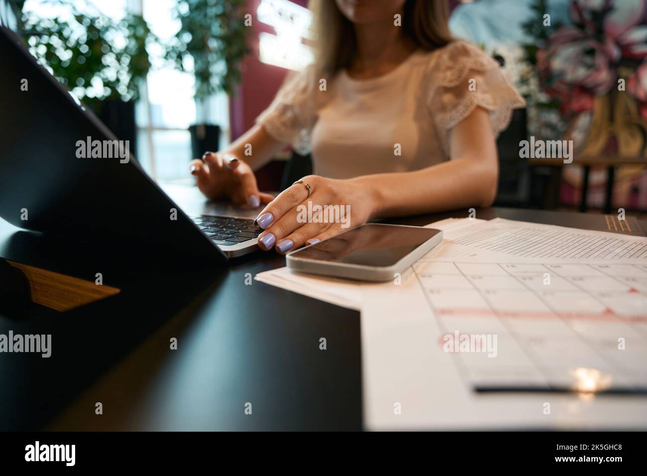 Modern company employee using laptop in workplace Stock Photo - Alamy