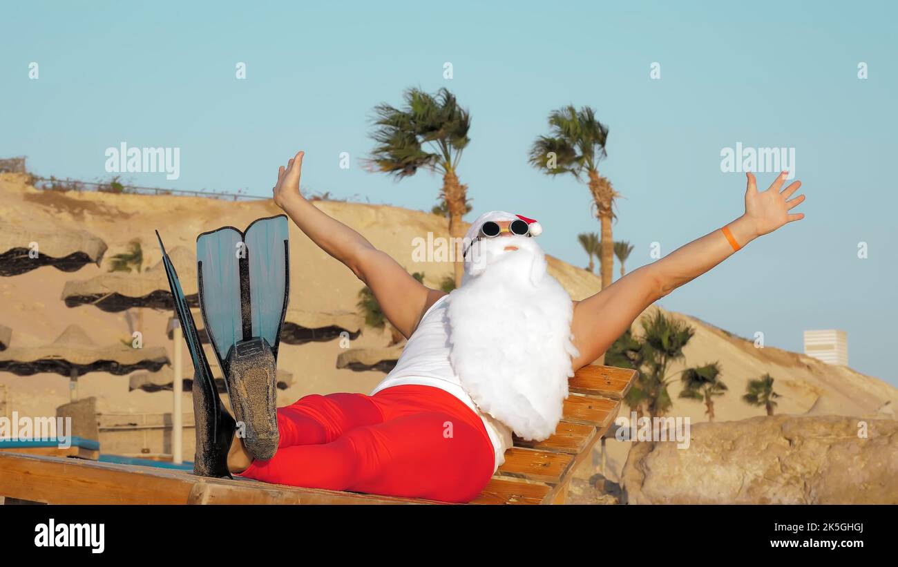 Santa Claus summer vacation. Santa Claus sunbathes. Funny Santa, in ...