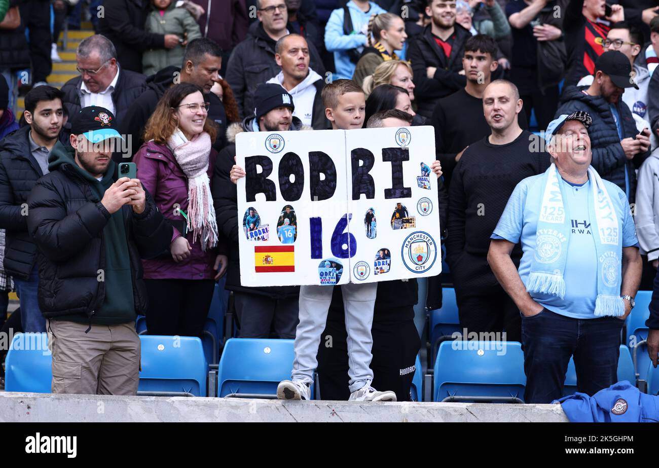 Manchester, England, 8th October 2022. A young fan supports Rodri of ...