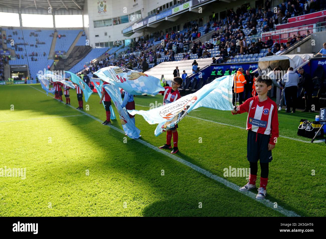 The Guard of Honour wave flags pitch side before the Sky Bet ...
