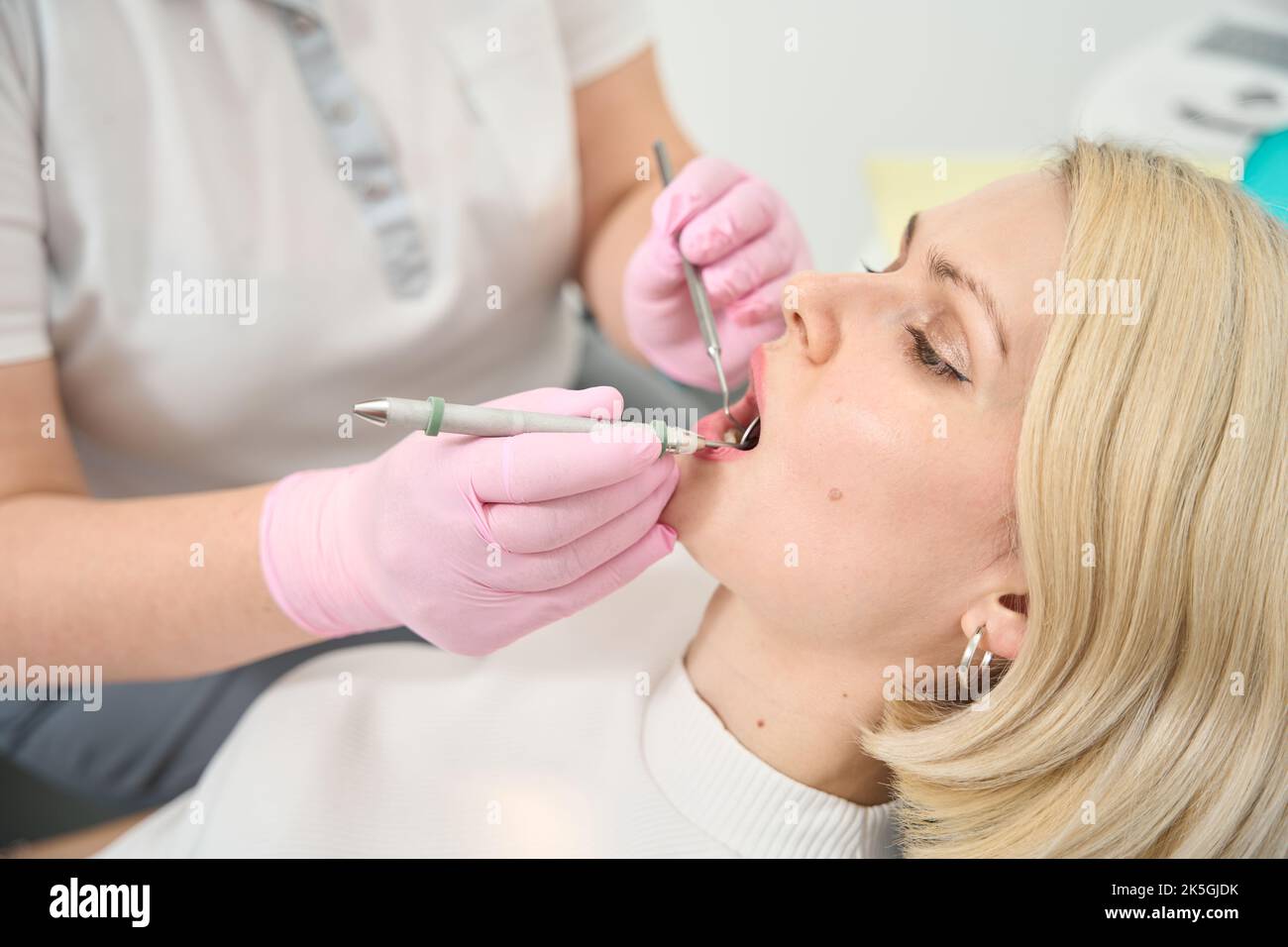 Open mouth during dental treatment hi-res stock photography and images ...
