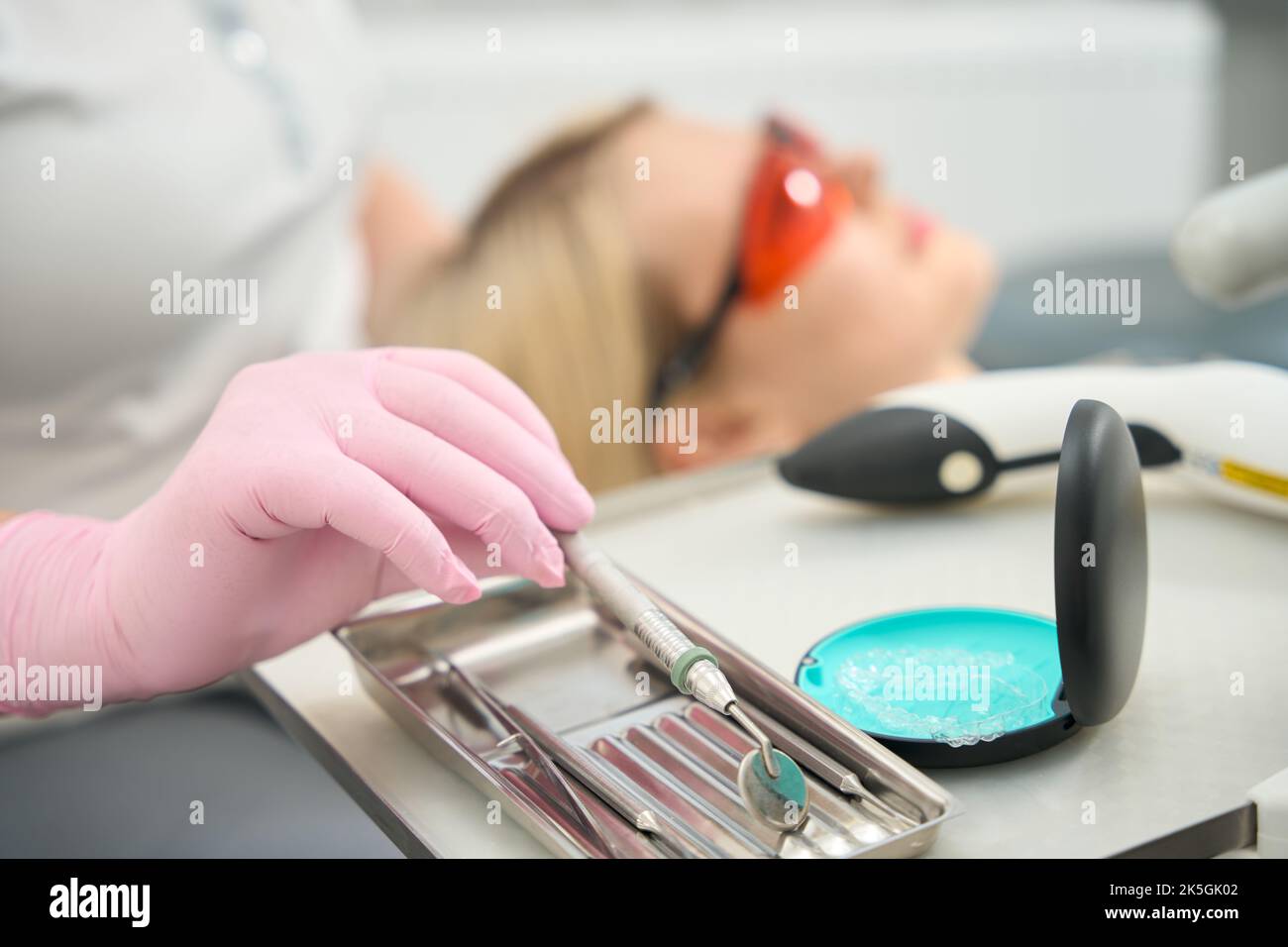 Doctor takes working tools from the table Stock Photo - Alamy