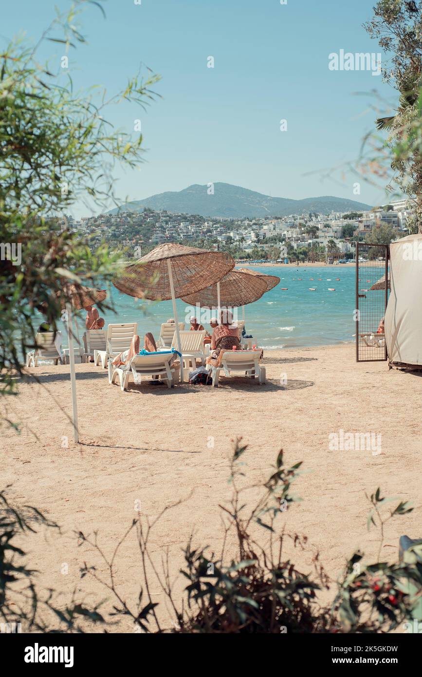 Relaxing on a sunny day on the beach Stock Photo - Alamy