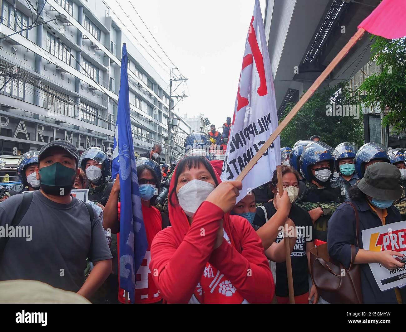 A protester seen waving a flag during the demonstration. Militant ...