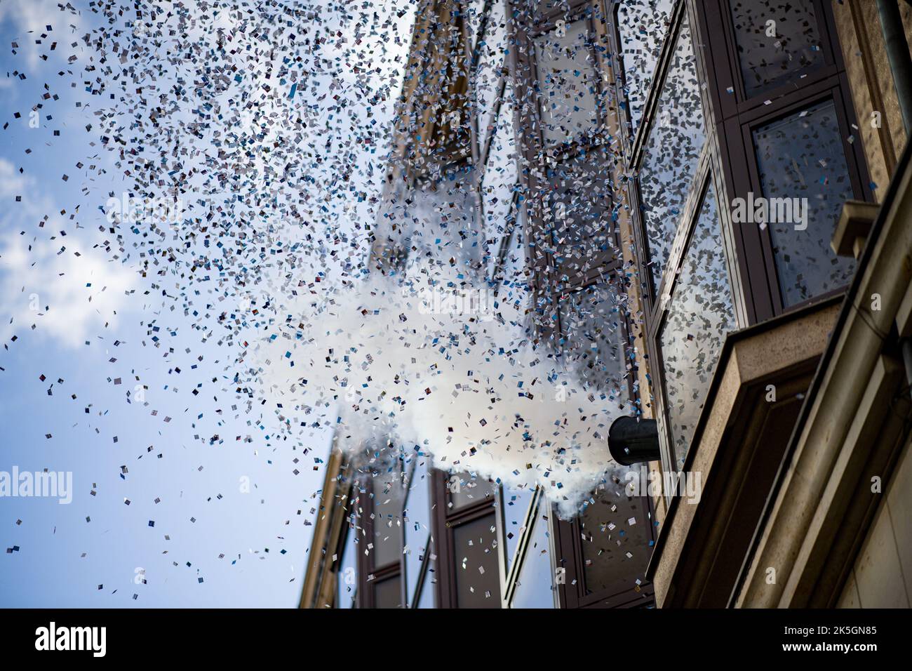 Berlin, Germany. 08th Oct, 2022. Shredded AfD flyers fly out of a ...