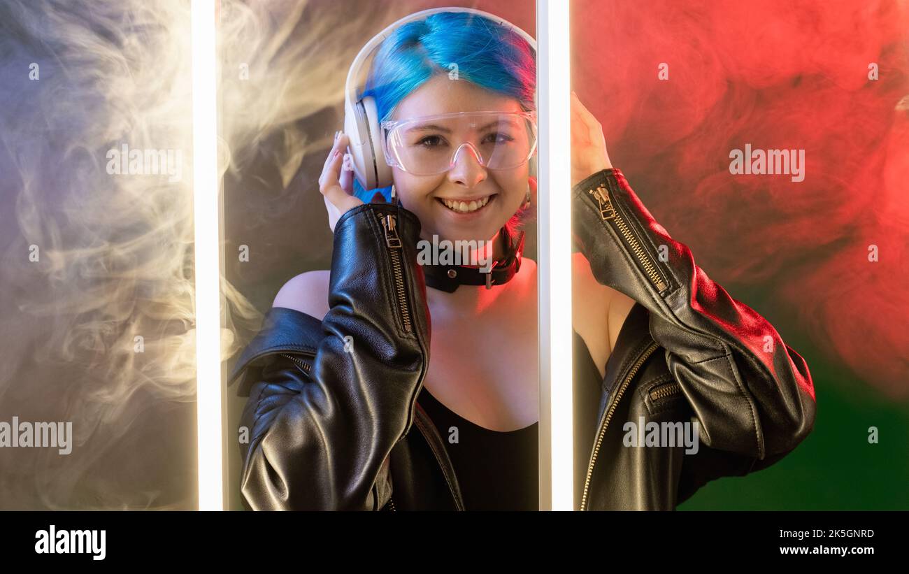 Nightclub DJ. Techno music. Cyber gadget. Cheerful smiling woman ...