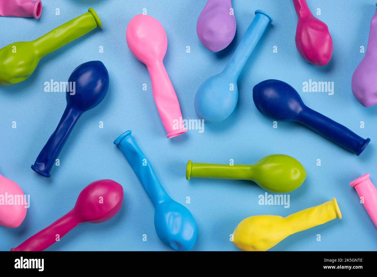 multi-colored balloons on a blue background, top view, the concept of ...