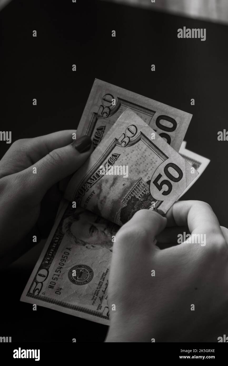 Counting 20 dollar bills hand hi-res stock photography and images - Alamy