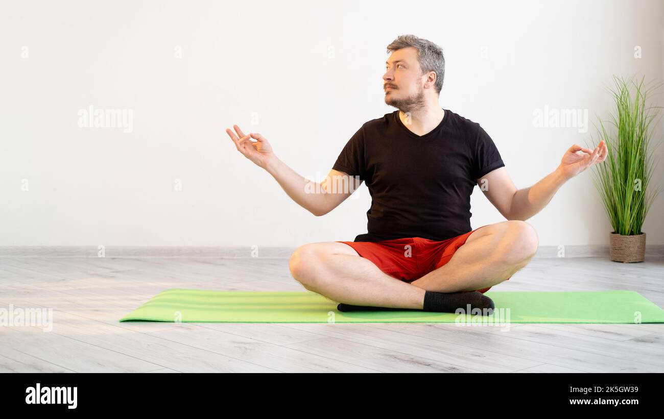 yoga meditation calm man harmony balance home Stock Photo - Alamy