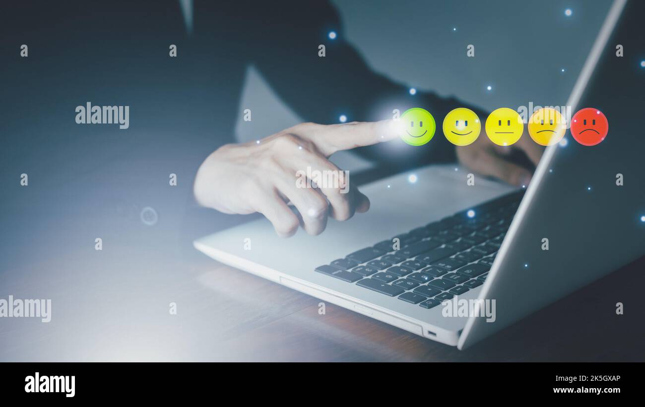 Businessman hand touch smile rating to feedback survey concept ...