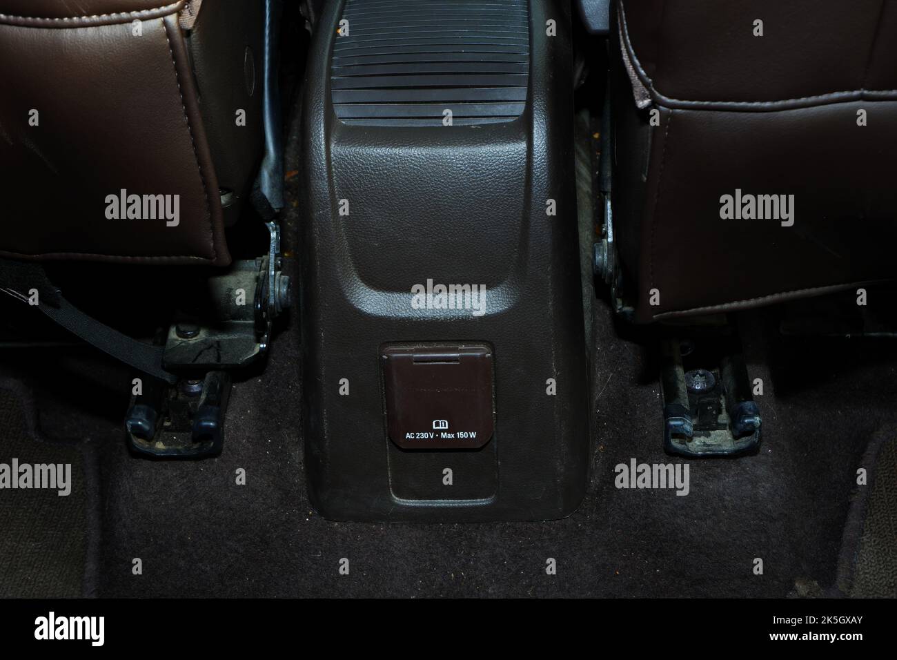 220 Volt Power socket at the backseat of a luxury car Stock Photo - Alamy