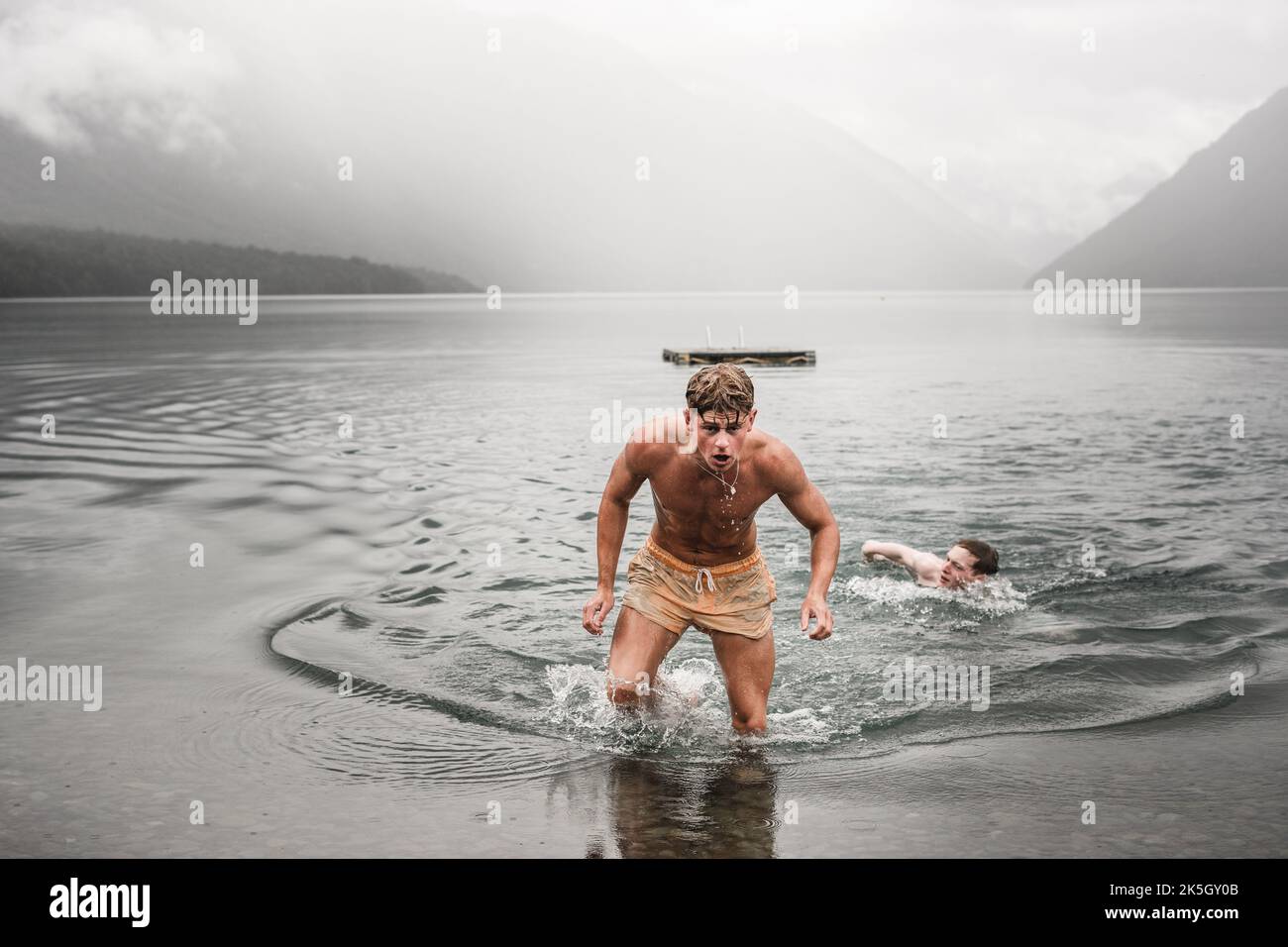caucasian boy coming out of the water tired with his mouth open after ...