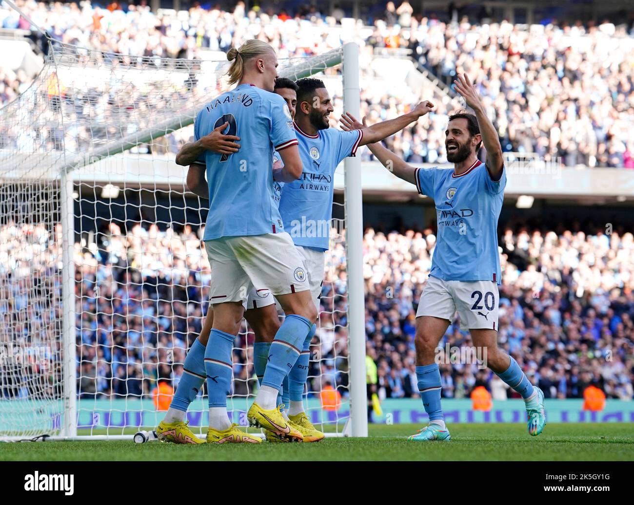 Manchester City's Erling Haaland (left) celebrates with team-mates ...