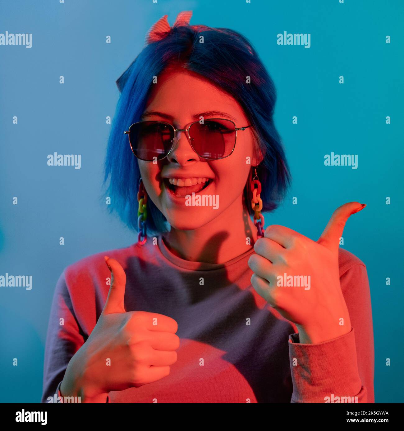 Thumbs up gesture. Approval sign. Right choice. Red neon color light ...